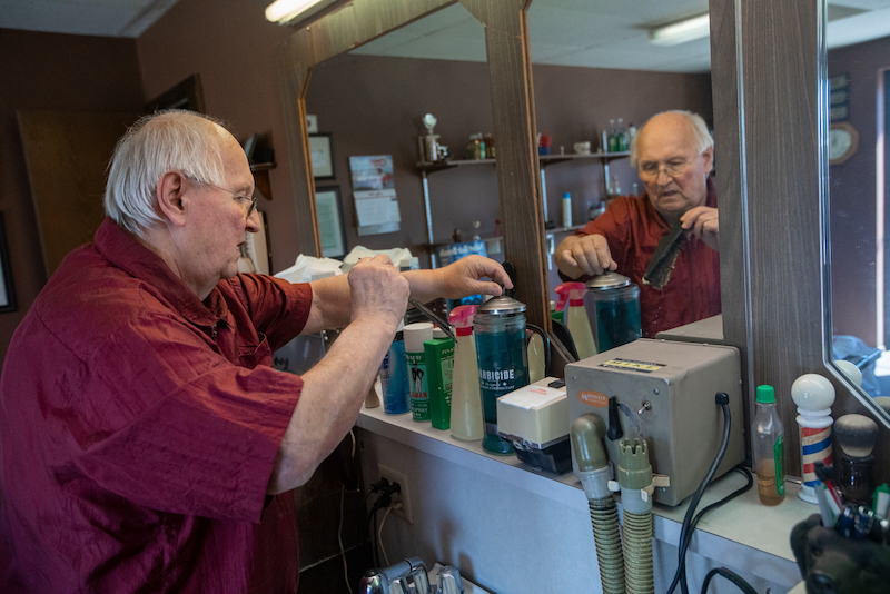 At 135,000 haircuts and counting, city's long-serving barber keeps ...