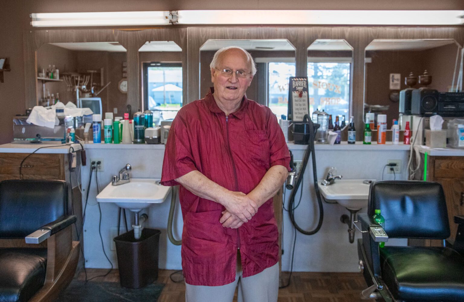 At 135,000 haircuts and counting, city's long-serving barber keeps ...